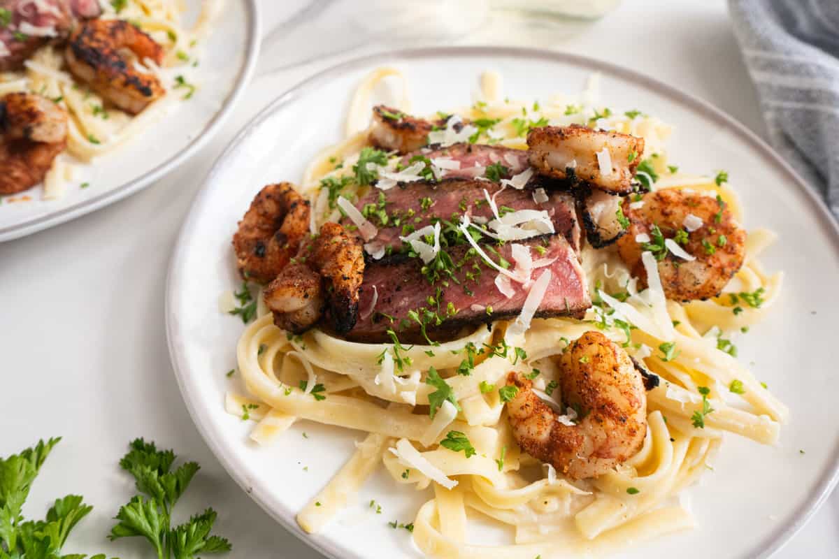 Steak and Cajun Shrimp Alfredo - Burnt Pellet BBQ